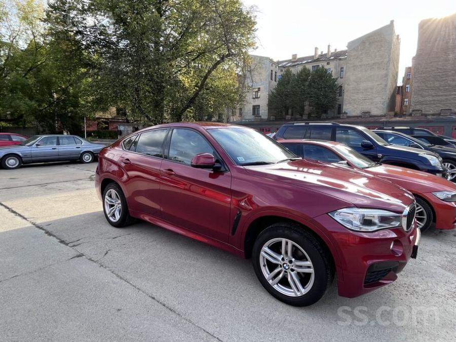 Red BMW X6 2018 in Riga, with an engine capacity of 3.00 L and mileage of 145 thousand km for 28500 €, photo 4 on AUTOMOTO.COM.LV