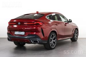 Red BMW X6 2021 in Riga, with an engine capacity of 3.00 L and mileage of 112 thousand km for 55000 €, photo 4 on AUTOMOTO.COM.LV