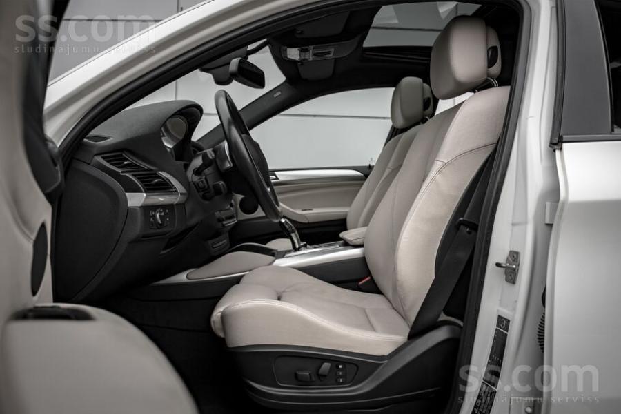 White BMW X6 2010 in Riga, with an engine capacity of 3.00 L and mileage of 239 thousand km for 9990 €, photo 12 on AUTOMOTO.COM.LV