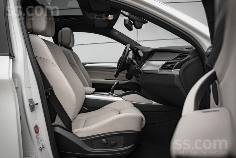 White BMW X6 2010 in Riga, with an engine capacity of 3.00 L and mileage of 239 thousand km for 9990 €, photo 14 on AUTOMOTO.COM.LV