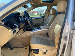 White BMW X6 2014 in Riga, with an engine capacity of 3.00 L and mileage of 142 thousand km for 20950 €, photo 9 on AUTOMOTO.COM.LV
