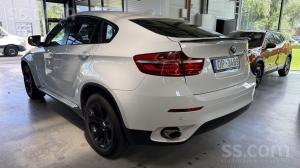 White BMW X6 2014 in Riga, with an engine capacity of 3.00 L and mileage of 231 thousand km for 12900 €, photo 4 on AUTOMOTO.COM.LV
