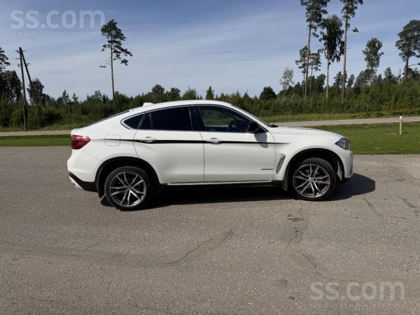 White BMW X6 2017 in Riga, with an engine capacity of 3.00 L and mileage of 180 thousand km for 23500 €, photo 2 on AUTOMOTO.COM.LV