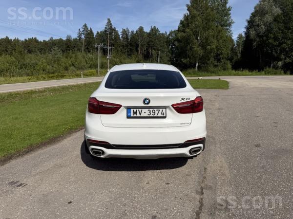 White BMW X6 2017 in Riga, with an engine capacity of 3.00 L and mileage of 180 thousand km for 23500 €, photo 4 on AUTOMOTO.COM.LV
