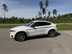 White BMW X6 2017 in Riga, with an engine capacity of 3.00 L and mileage of 180 thousand km for 23500 €, photo 6 on AUTOMOTO.COM.LV