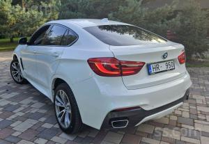 White BMW X6 2018 in Riga, with an engine capacity of 3.00 L and mileage of 148 thousand km for 30300 €, photo 4 on AUTOMOTO.COM.LV