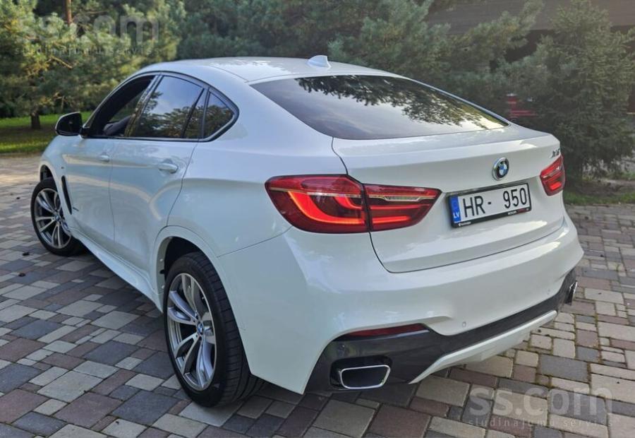 White BMW X6 2018 in Riga, with an engine capacity of 3.00 L and mileage of 148 thousand km for 30300 €, photo 4 on AUTOMOTO.COM.LV