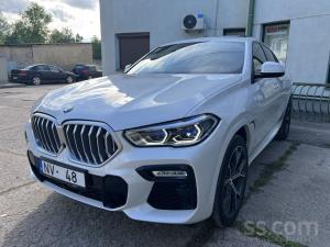 White BMW X6 2020 in Riga, with an engine capacity of 3.00 L and mileage of 108 thousand km for 55750 €, photo 4 on AUTOMOTO.COM.LV