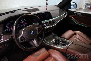 Red BMW X7 2019 in Riga, with an engine capacity of 3.00 L and mileage of 115 thousand km for 47500 €, photo 14 on AUTOMOTO.COM.LV