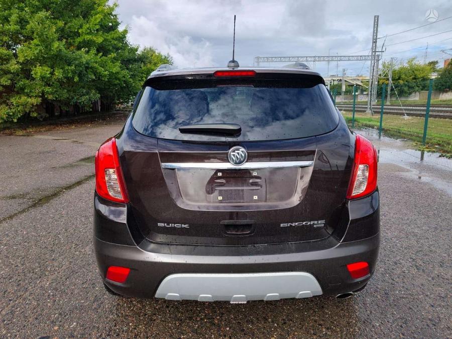Red Buick Encore 2016 in Siauliai, with an engine capacity of 1.40 L and mileage of 186 thousand km for 7200 €, photo 6 on AUTOMOTO.COM.LV