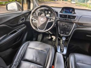 Red Buick Encore 2016 in Siauliai, with an engine capacity of 1.40 L and mileage of 186 thousand km for 7200 €, photo 11 on AUTOMOTO.COM.LV