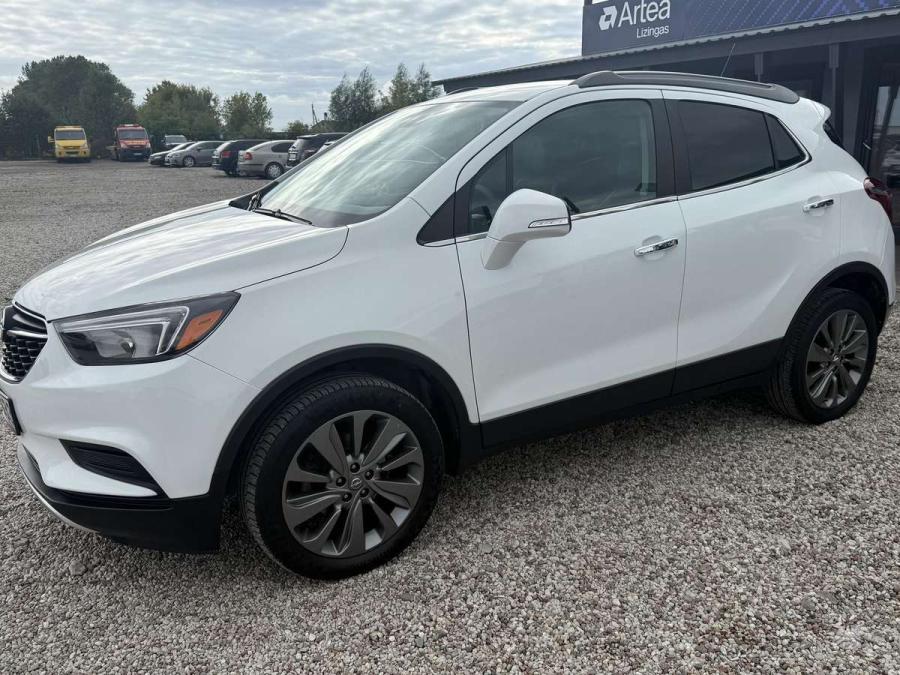 White Buick Encore 2018 in Kretinga, with an engine capacity of 1.36 L and mileage of 156 thousand km for 10750 €, photo 13 on AUTOMOTO.COM.LV