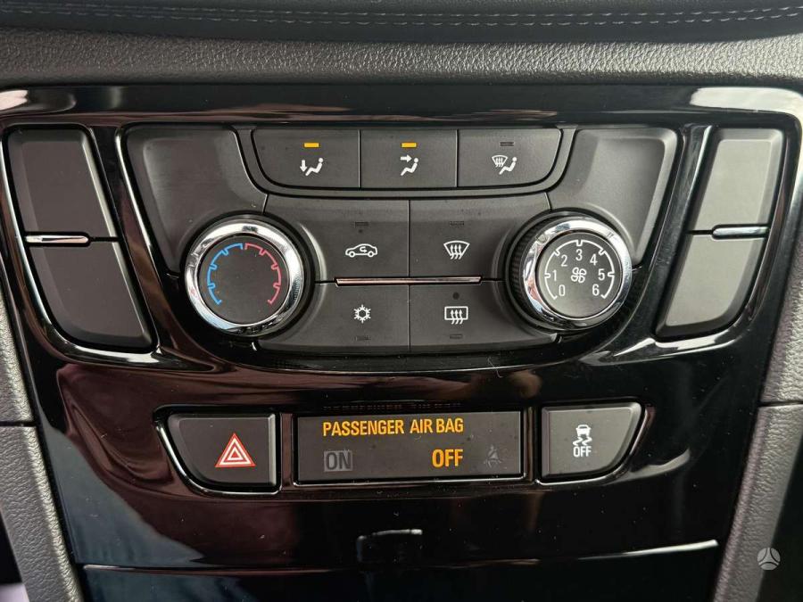 White Buick Encore 2018 in Kretinga, with an engine capacity of 1.36 L and mileage of 156 thousand km for 10750 €, photo 23 on AUTOMOTO.COM.LV