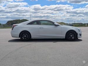 White Cadillac ATS 2016 in Kaunas, with an engine capacity of 2.00 L and mileage of 58 thousand km for 14500 €, photo 4 on AUTOMOTO.COM.LV