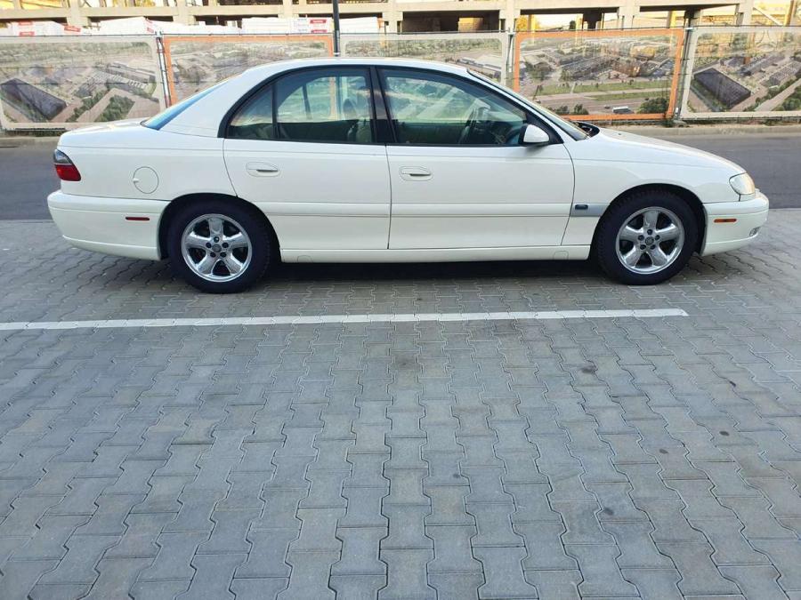 White Cadillac Catera 1998 in Vilnius, with an engine capacity of 2.96 L and mileage of 112 thousand km for 4999 €, photo 5 on AUTOMOTO.COM.LV