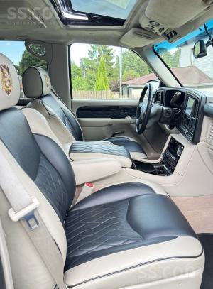 Melns Cadillac Escalade 2002 Rīga, ar dzinēja tilpumu 6.00 L un nobraukumu 71 tūkst. km par 12800 €, foto 12 vietnē AUTOMOTO.COM.LV