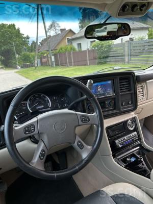 Melns Cadillac Escalade 2002 Rīga, ar dzinēja tilpumu 6.00 L un nobraukumu 71 tūkst. km par 12800 €, foto 21 vietnē AUTOMOTO.COM.LV