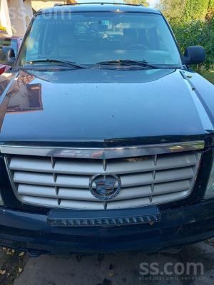 Melns Cadillac Escalade 2005 Rīga, ar dzinēja tilpumu 6.00 L un nobraukumu 319 tūkst. km par 5500 €, foto 3 vietnē AUTOMOTO.COM.LV