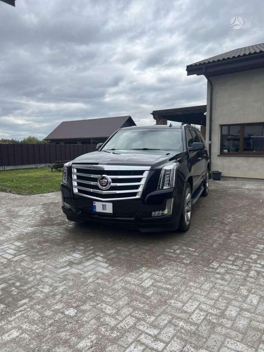 Black Cadillac Escalade 2015 in Vilnius, with an engine capacity of 6.16 L and mileage of 266 thousand km for 20999 €, photo 1 on AUTOMOTO.COM.LV