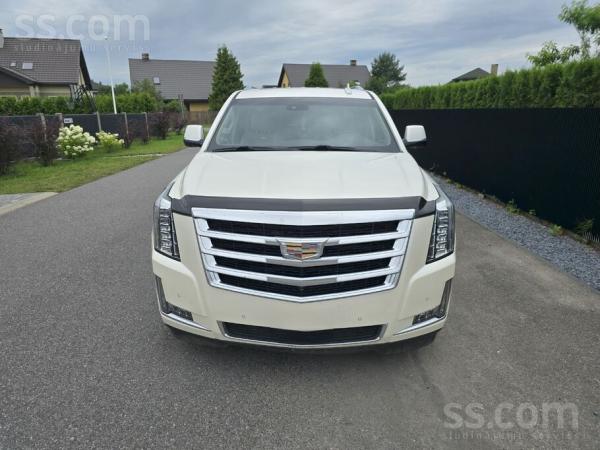 White Cadillac Escalade 2015 in Riga, with an engine capacity of 6.20 L and mileage of 128 thousand km for 23500 €, photo 4 on AUTOMOTO.COM.LV