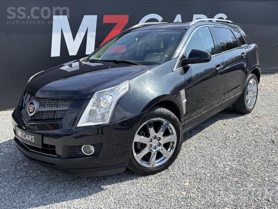 Black Cadillac SRX 2013 in Riga, with an engine capacity of 3.00 L and mileage of 137 thousand km for 9990 €, photo 1 on AUTOMOTO.COM.LV