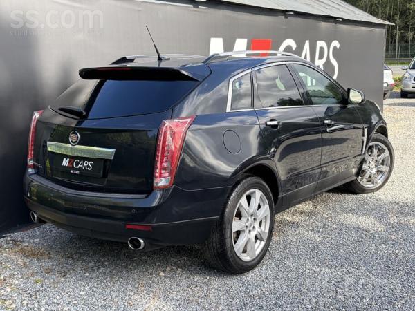 Black Cadillac SRX 2013 in Riga, with an engine capacity of 3.00 L and mileage of 137 thousand km for 9990 €, photo 3 on AUTOMOTO.COM.LV