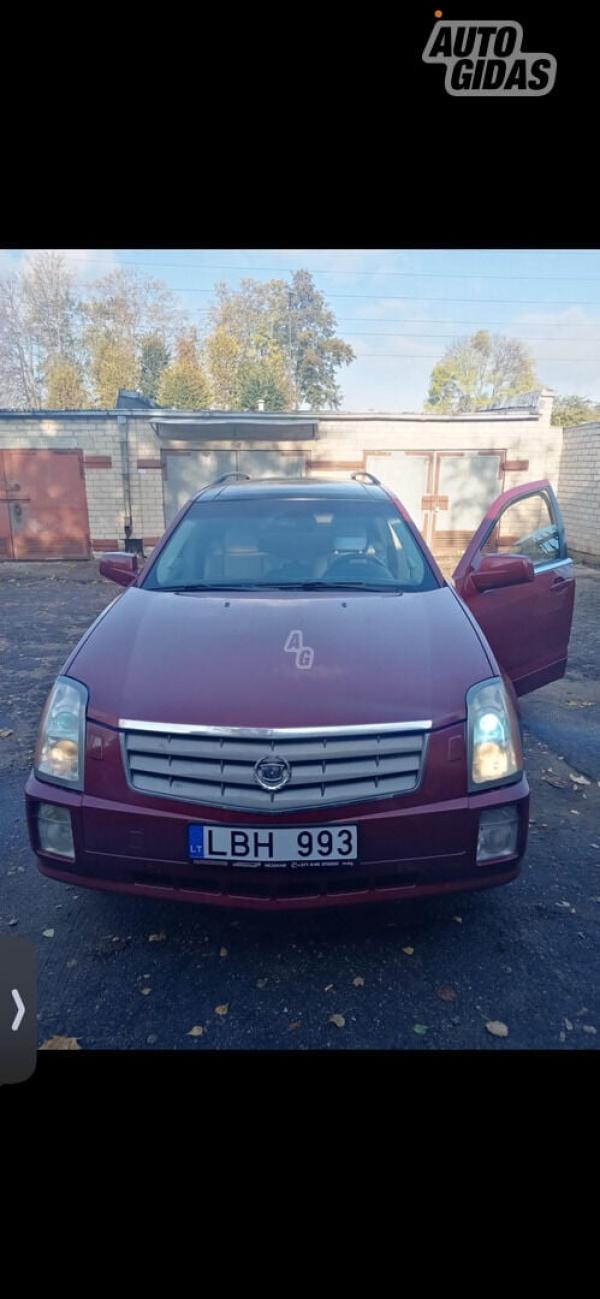 Sarkans Cadillac SRX 2005 Kauņa, ar dzinēja tilpumu 3.60 L un nobraukumu 180 tūkst. km par 1200 €, foto 1 vietnē AUTOMOTO.COM.LV