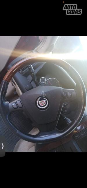 Red Cadillac SRX 2005 in Kaunas, with an engine capacity of 3.60 L and mileage of 180 thousand km for 1200 €, photo 9 on AUTOMOTO.COM.LV