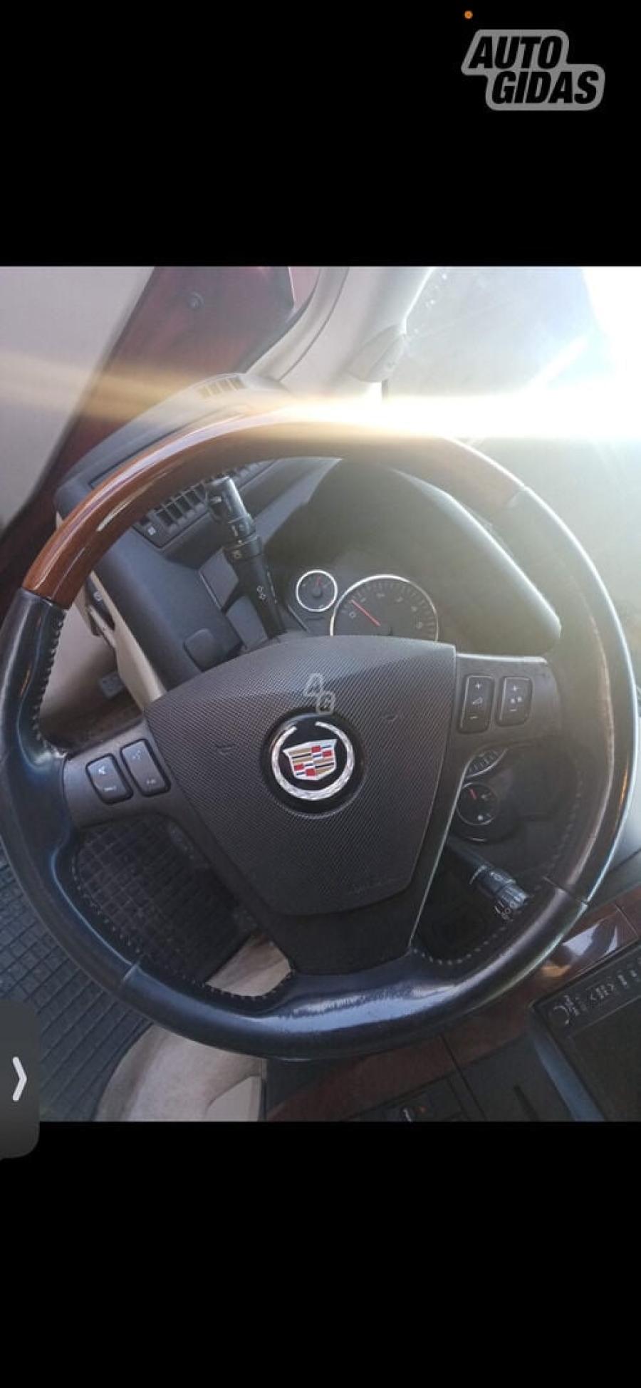 Red Cadillac SRX 2005 in Kaunas, with an engine capacity of 3.60 L and mileage of 180 thousand km for 1200 €, photo 9 on AUTOMOTO.COM.LV