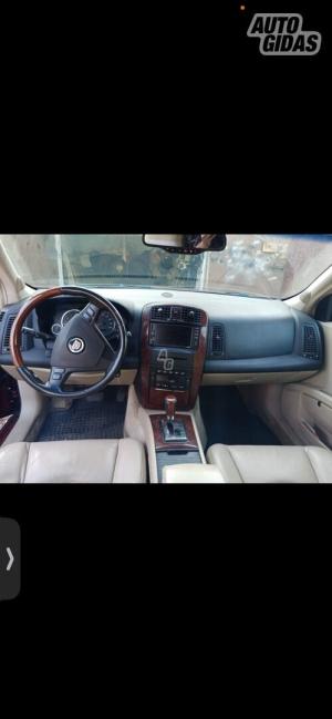 Red Cadillac SRX 2005 in Kaunas, with an engine capacity of 3.60 L and mileage of 180 thousand km for 1200 €, photo 11 on AUTOMOTO.COM.LV