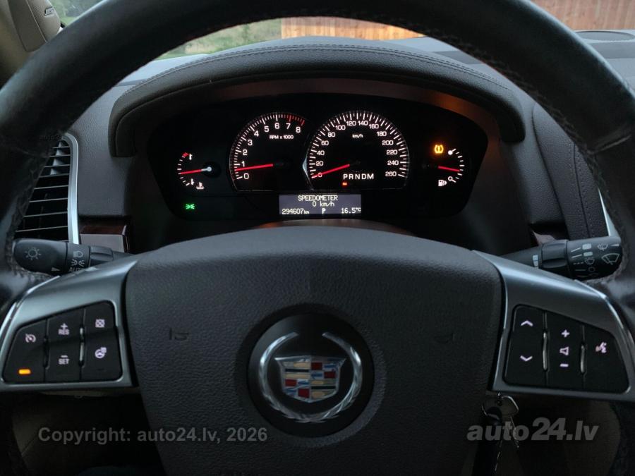 Red Cadillac SRX 2008 in Tartu, with an engine capacity of 3.60 L and mileage of 295 thousand km for 3790 €, photo 19 on AUTOMOTO.COM.LV