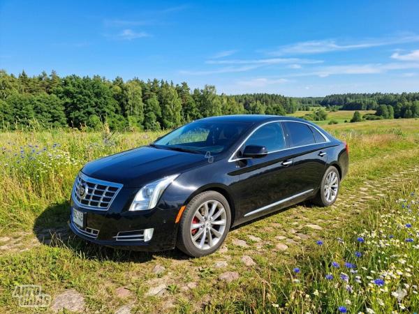 Black Cadillac XTS 2014 in Telschi, with an engine capacity of 3.60 L and mileage of 215 thousand km for 11000 €, photo 1 on AUTOMOTO.COM.LV