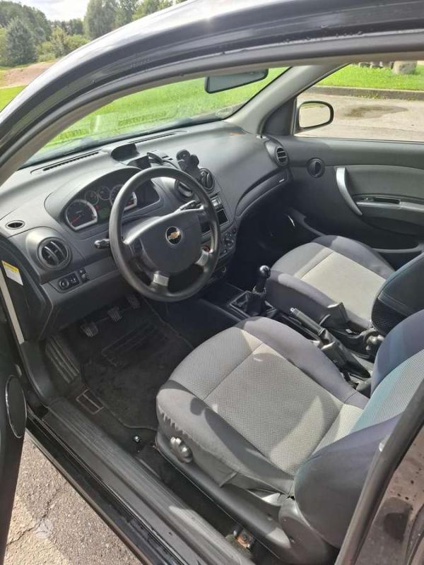 Black Chevrolet Aveo 2009 in Siauliai, with an engine capacity of 1.21 L and mileage of 174 thousand km for 1350 €, photo 5 on AUTOMOTO.COM.LV