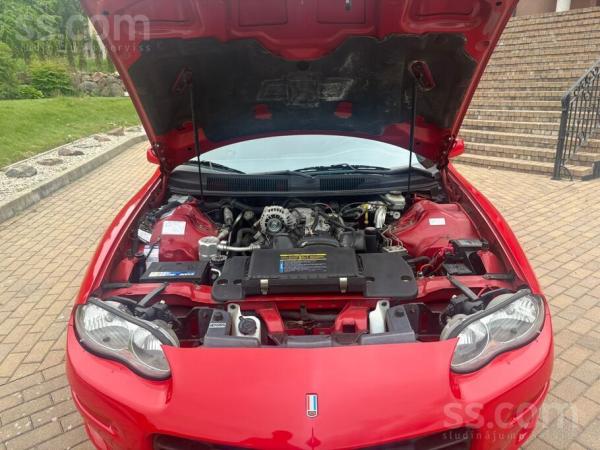 Sarkans Chevrolet Camaro 2000 Tukums, ar dzinēja tilpumu 3.80 L un nobraukumu 57 tūkst. km par 15000 €, foto 5 vietnē AUTOMOTO.COM.LV