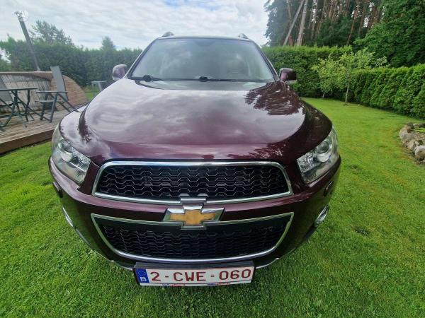 Red Chevrolet Captiva 2013 in Ukmerge, with an engine capacity of 2.23 L and mileage of 201 thousand km for 4750 €, photo 7 on AUTOMOTO.COM.LV