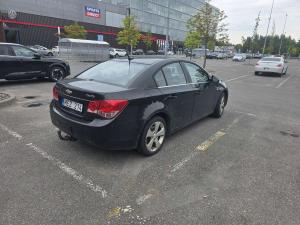 Black Chevrolet Cruze 2012 in Vilnius, with an engine capacity of 2.00 L and mileage of 261 thousand km for 1600 €, photo 4 on AUTOMOTO.COM.LV
