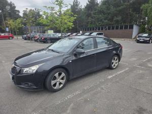 Black Chevrolet Cruze 2012 in Vilnius, with an engine capacity of 2.00 L and mileage of 261 thousand km for 1600 €, photo 14 on AUTOMOTO.COM.LV