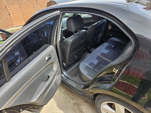 Black Chevrolet Epica 2006 in Silute, with an engine capacity of 2.50 L and mileage of 275 thousand km for 1550 €, photo 6 on AUTOMOTO.COM.LV