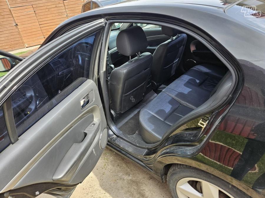 Black Chevrolet Epica 2006 in Silute, with an engine capacity of 2.50 L and mileage of 275 thousand km for 1550 €, photo 7 on AUTOMOTO.COM.LV
