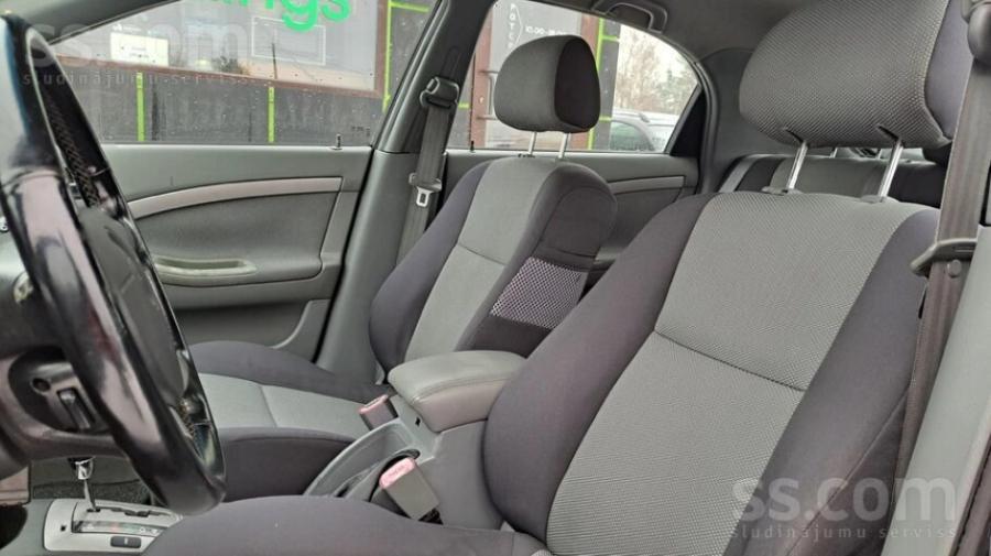 Black Chevrolet Lacetti 2007 in Riga, with an engine capacity of 2.00 L and mileage of 169 thousand km for 2950 €, photo 17 on AUTOMOTO.COM.LV