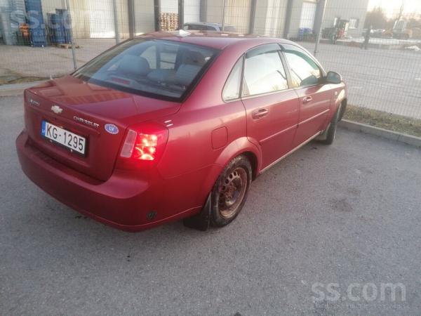 Sarkans Chevrolet Lacetti 2007 Cēsis, ar dzinēja tilpumu 1.40 L un nobraukumu 285 tūkst. km par 1900 €, foto 2 vietnē AUTOMOTO.COM.LV