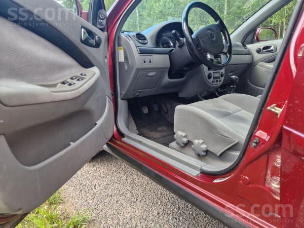 Sarkans Chevrolet Lacetti 2006 Jelgava, ar dzinēja tilpumu 1.60 L un nobraukumu 114 tūkst. km par 2250 €, foto 7 vietnē AUTOMOTO.COM.LV