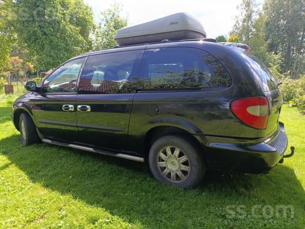 Melns Chrysler Grand Voyager 2003 Rīga, ar dzinēja tilpumu 2.50 L un nobraukumu 445 tūkst. km par 1600 €, foto 4 vietnē AUTOMOTO.COM.LV