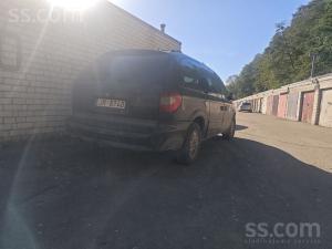 Black Chrysler Grand Voyager 2005 in Riga, with an engine capacity of 2.80 L and mileage of 317 thousand km for 1500 €, photo 4 on AUTOMOTO.COM.LV