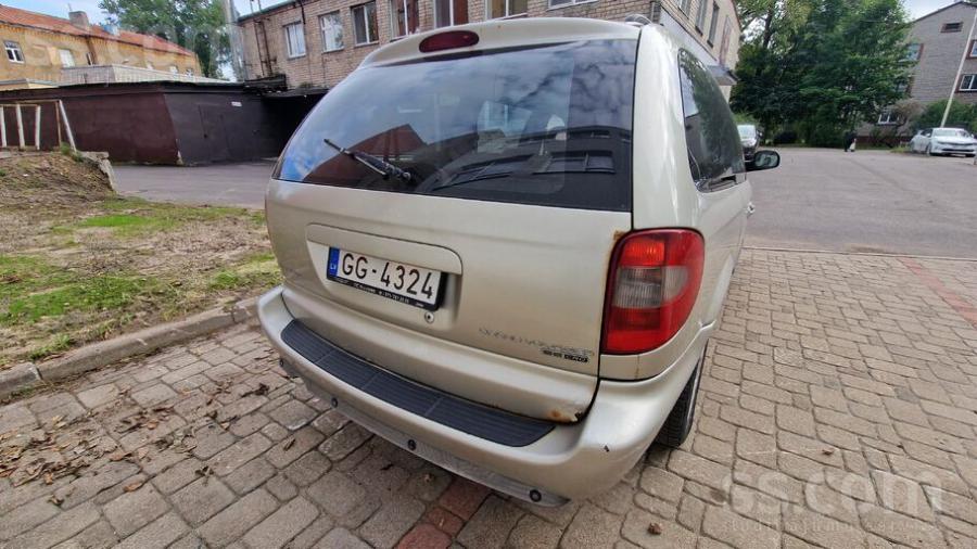 Yellow Chrysler Grand Voyager 2006 in Riga, with an engine capacity of 2.80 L and mileage of 248 thousand km for 600 €, photo 4 on AUTOMOTO.COM.LV