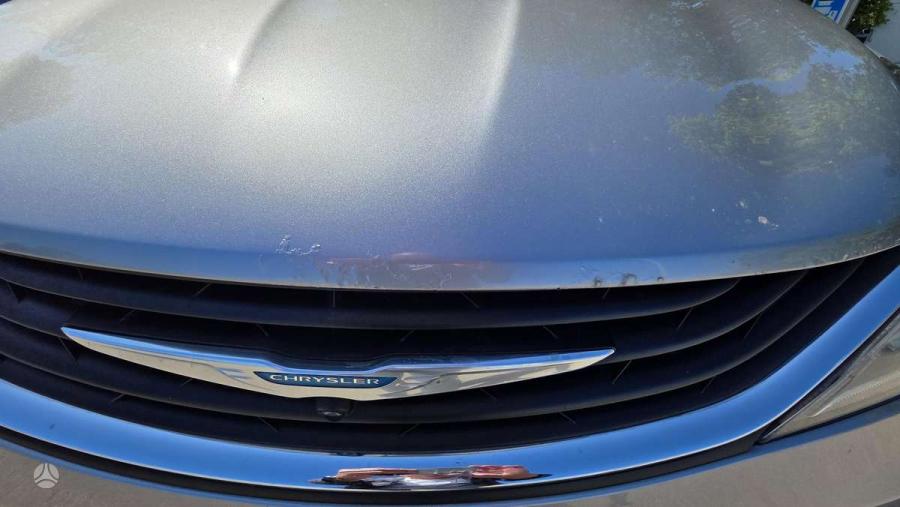 Grey Chrysler Pacifica 2018 in Kaunas, with an engine capacity of 3.61 L and mileage of 194 thousand km for 14000 €, photo 18 on AUTOMOTO.COM.LV