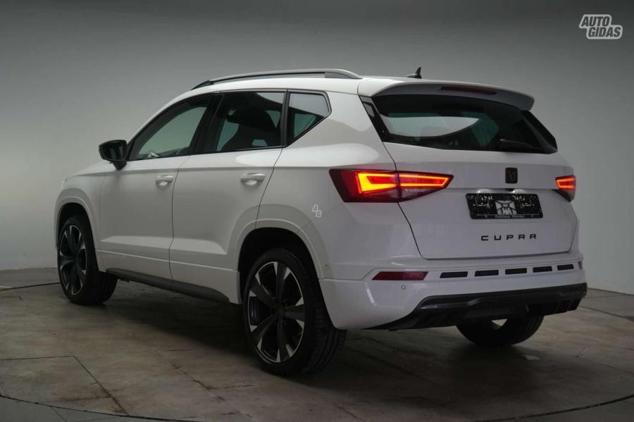 White Cupra ateca 2023 in Kaunas, with an engine capacity of 1.50 L and mileage of 58 thousand km for 31114 €, photo 5 on AUTOMOTO.COM.LV