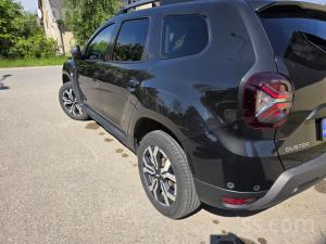 Black Dacia Duster 2023 in Riga, with an engine capacity of 1.00 L and mileage of 85 thousand km for 12850 €, photo 4 on AUTOMOTO.COM.LV