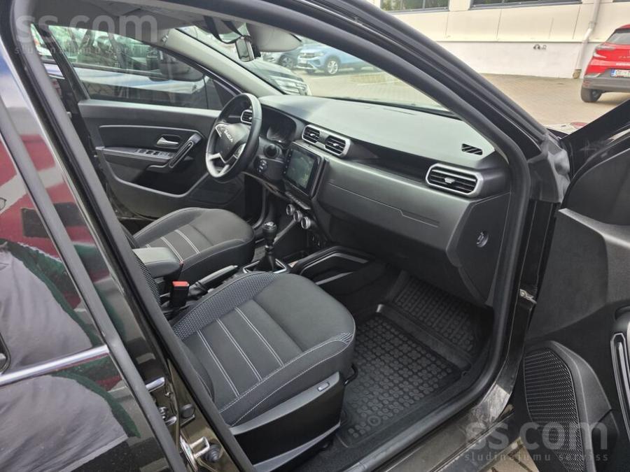 Black Dacia Duster 2023 in Riga, with an engine capacity of 1.00 L and mileage of 85 thousand km for 12850 €, photo 6 on AUTOMOTO.COM.LV
