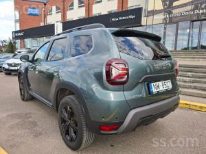 Green Dacia Duster 2023 in Riga, with an engine capacity of 1.00 L and mileage of 62 thousand km for 7700 €, photo 2 on AUTOMOTO.COM.LV